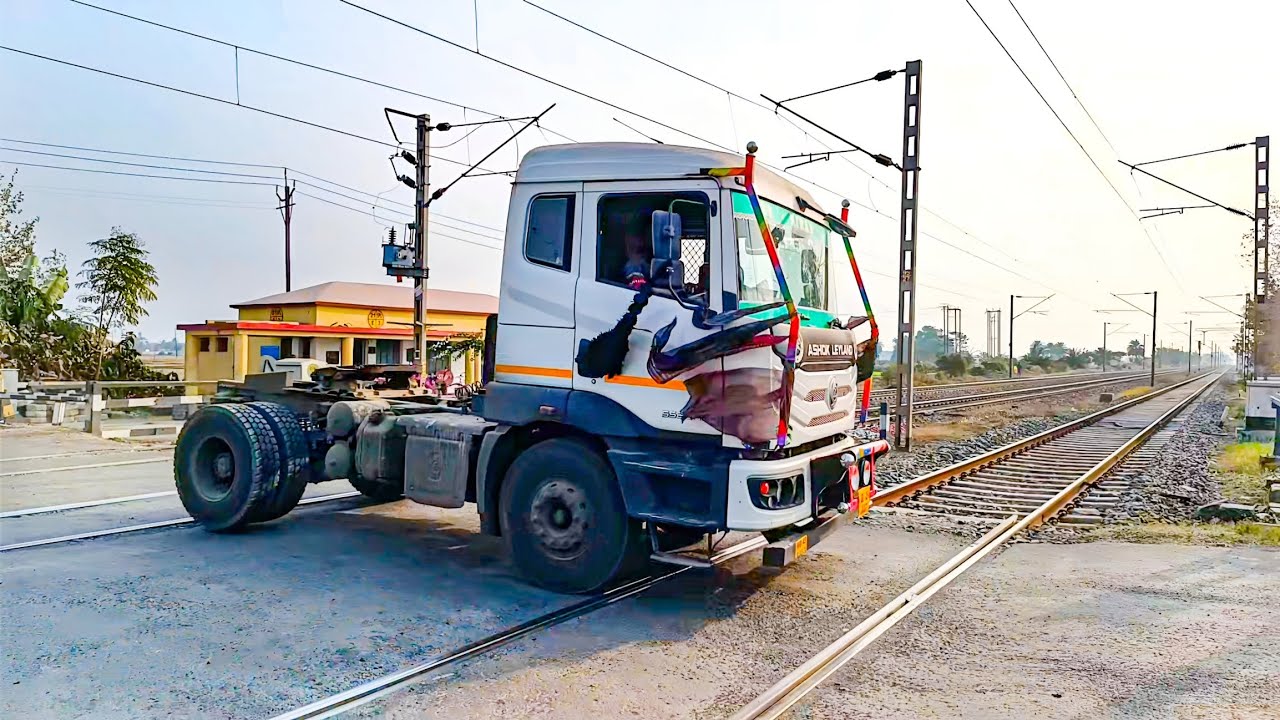 Long time rail gate open and many trucks passing through railroad while ...