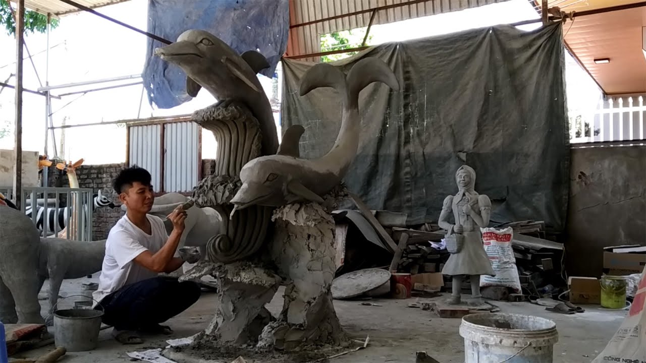 Design technique for garden dolphin statue with construction cement ...