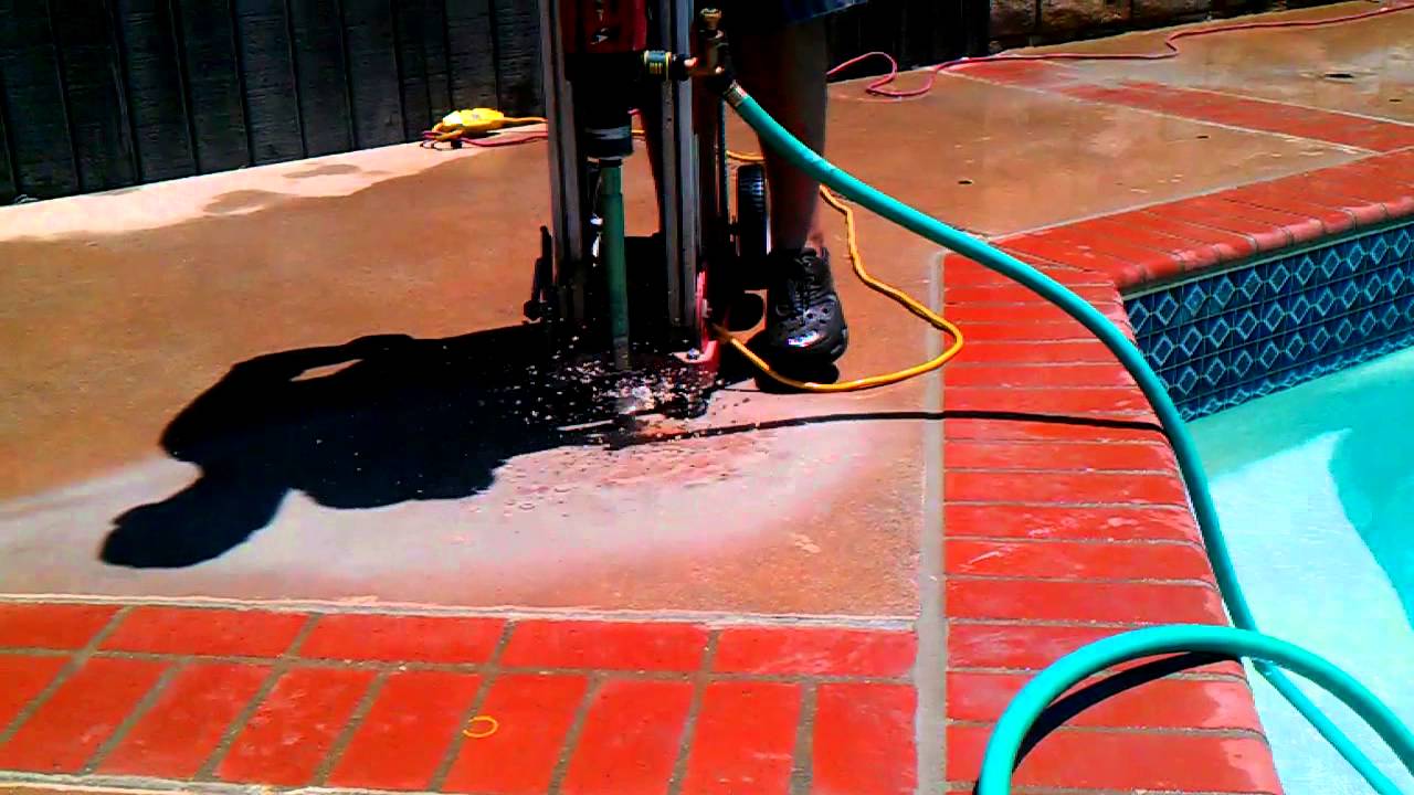 Drilling holes in concrete for Life Saver Pool Fence poles - YouTube