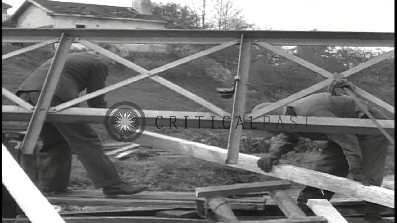 US 305th Engineer Battalion soldiers construct a makeshift bridge ...