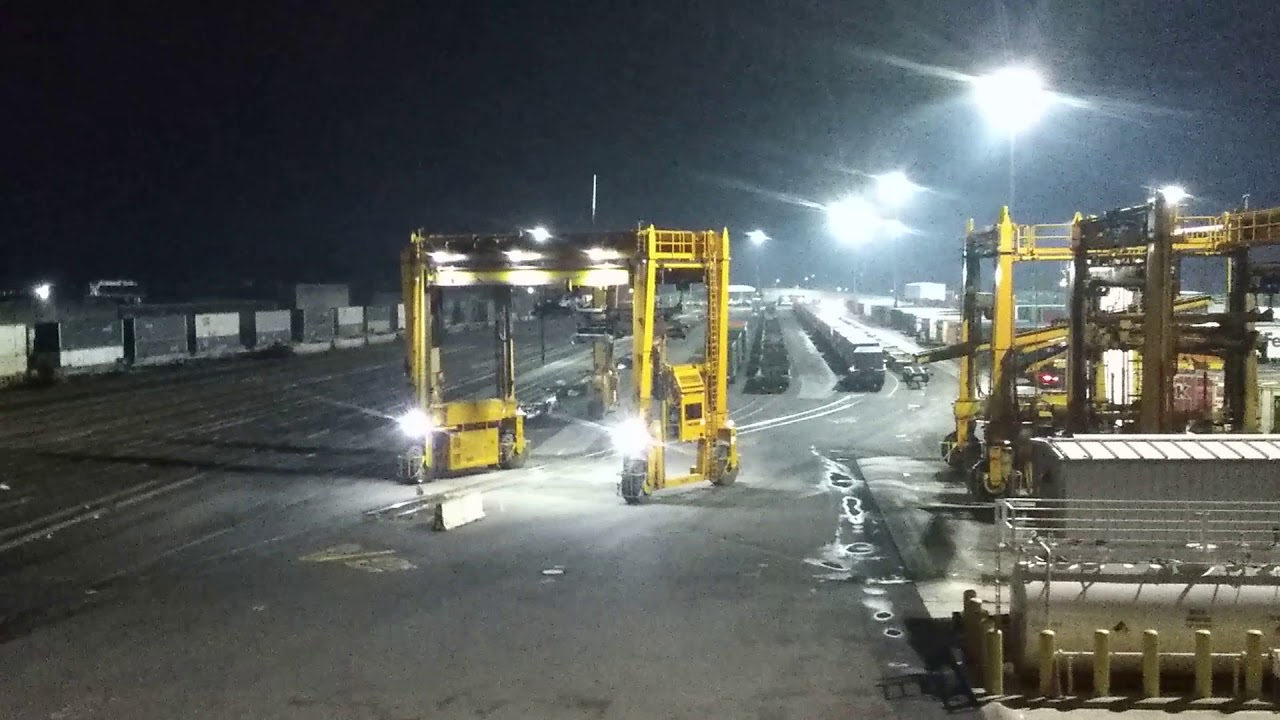 Check out this railroad yard, crane loads rail to truck - YouTube