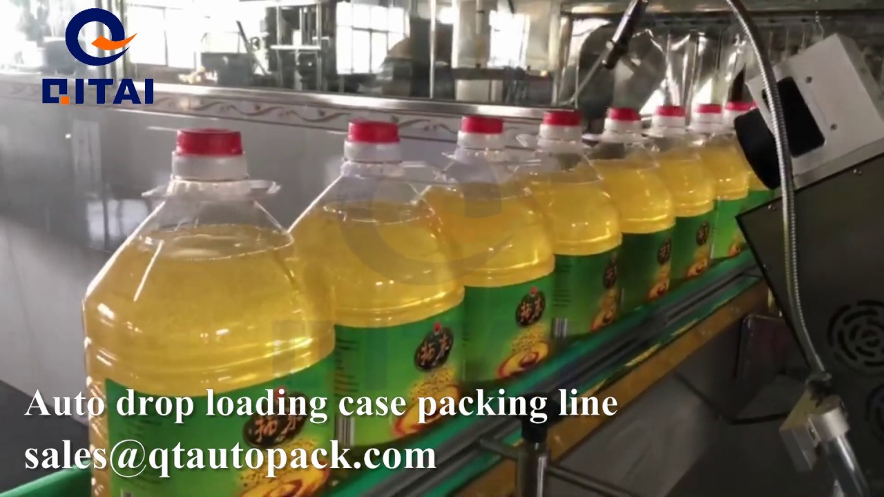 Auto drop loading case packer auto case packer - YouTube