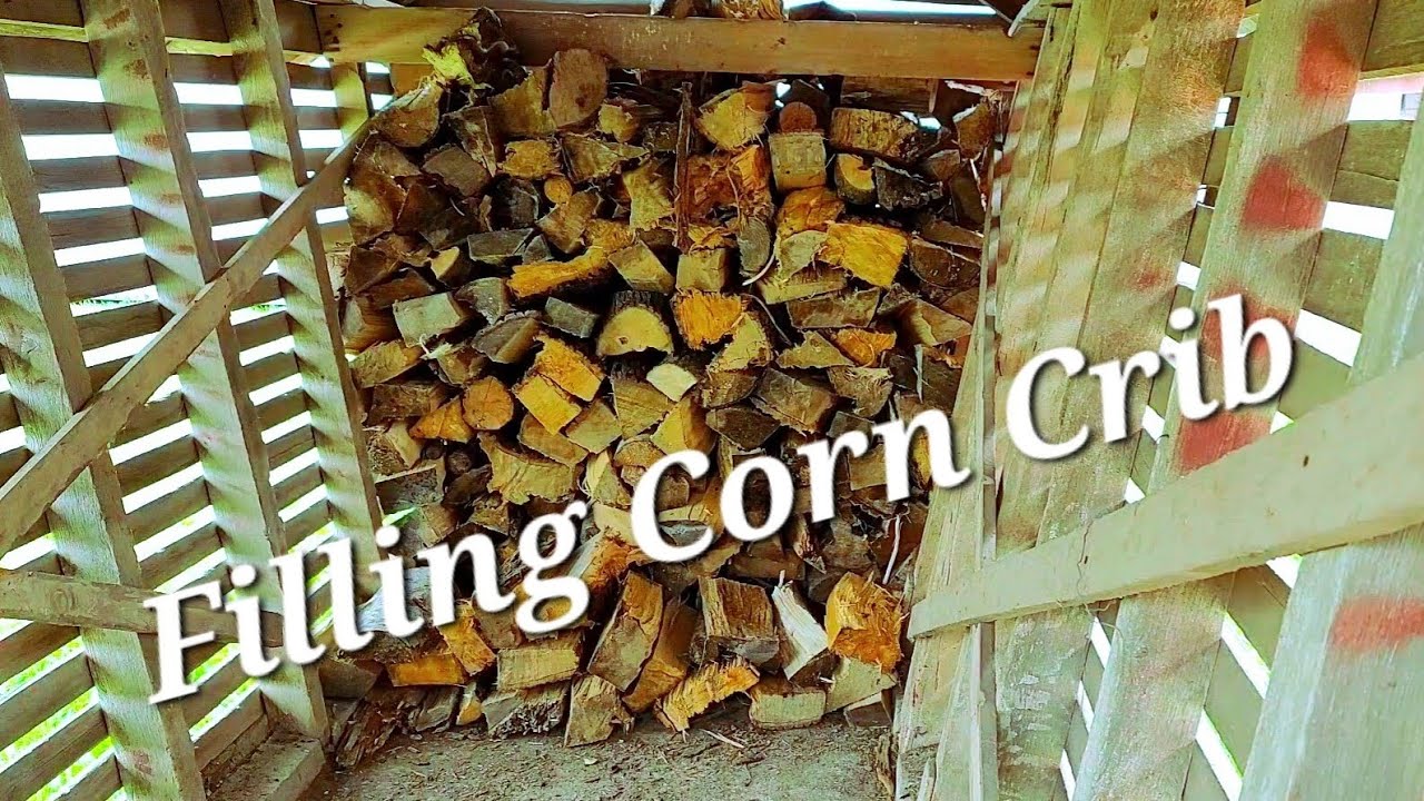 2 loads of wood filling the corn crib. - YouTube
