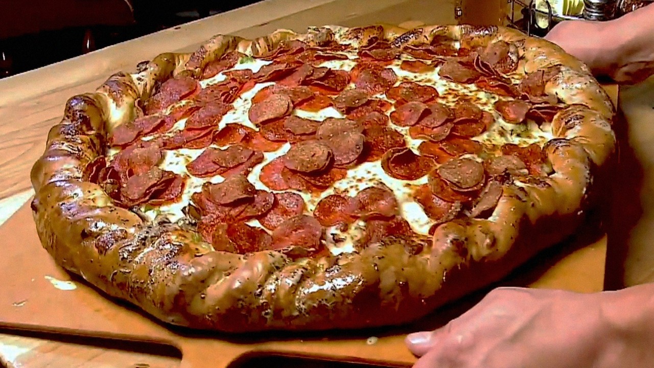 The Biggest Pizzas Ever Eaten On Man V Food - YouTube