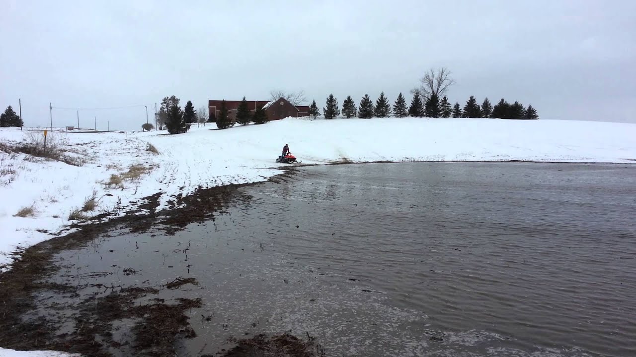 Snowmobiles water skip - YouTube