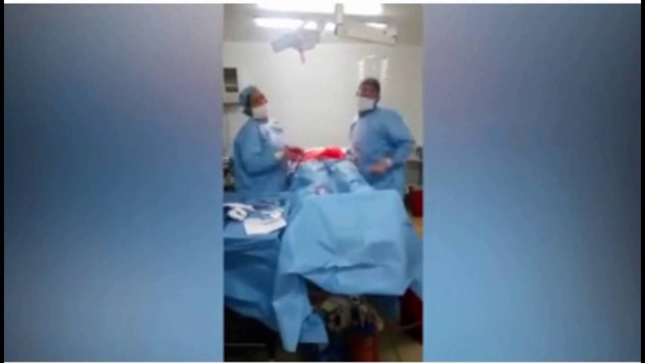 Plastic surgeon dancing in the middle of a major surgery! WTF - YouTube