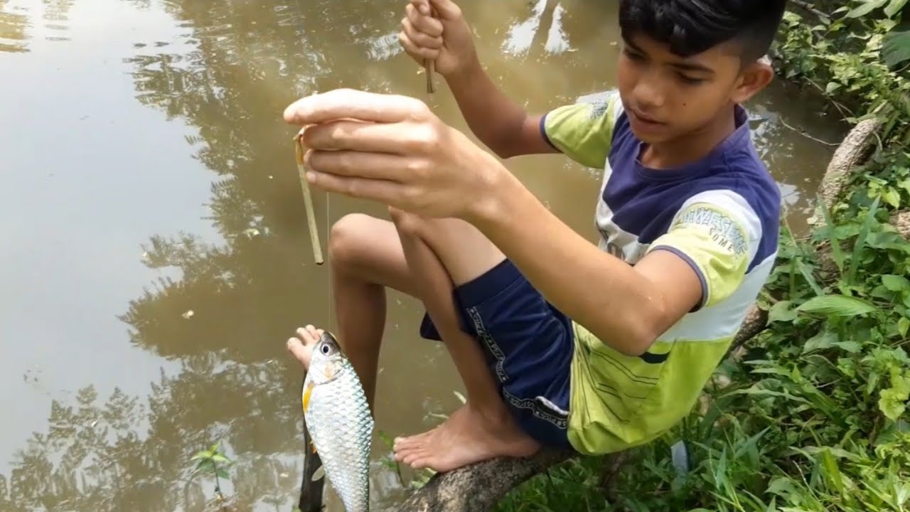 amazing hook fishing.Putti fish with fishing rod. Please help by ...