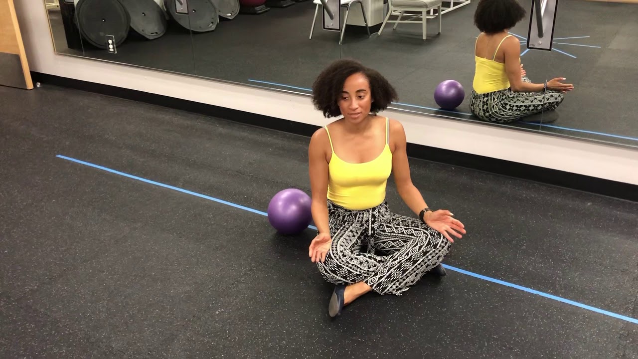 Minute Movement: Pilates Ball Spinal Extension - YouTube