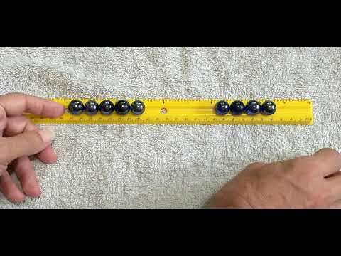 Physci 041 marble momentum on a ruler - YouTube