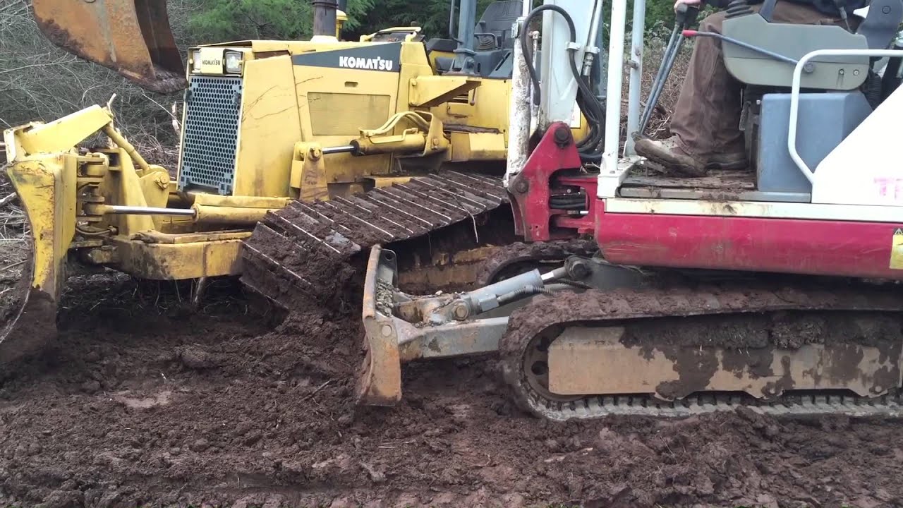 Putting a dozer track back on! - YouTube
