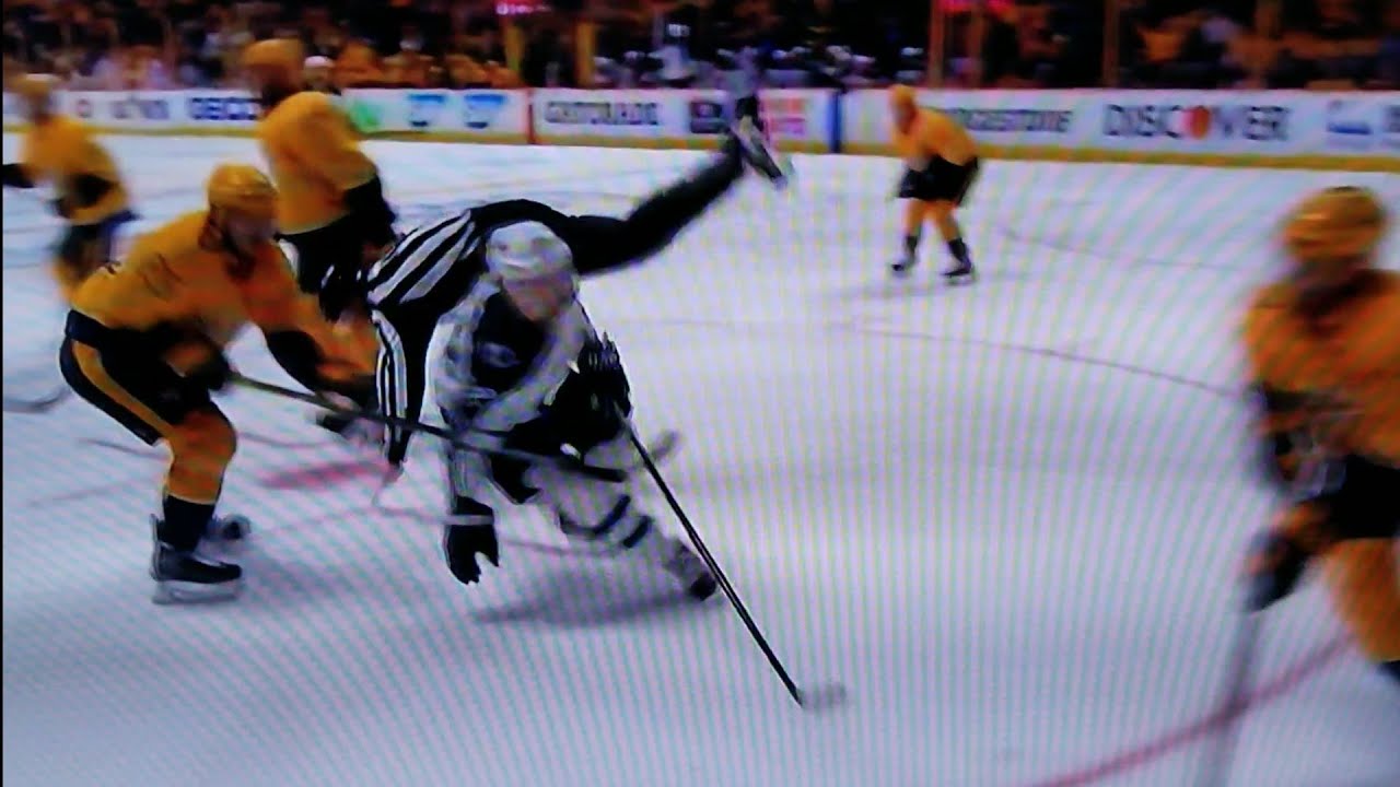 NHL Linesman Derek Amell nearly faceplants after faceoff - YouTube