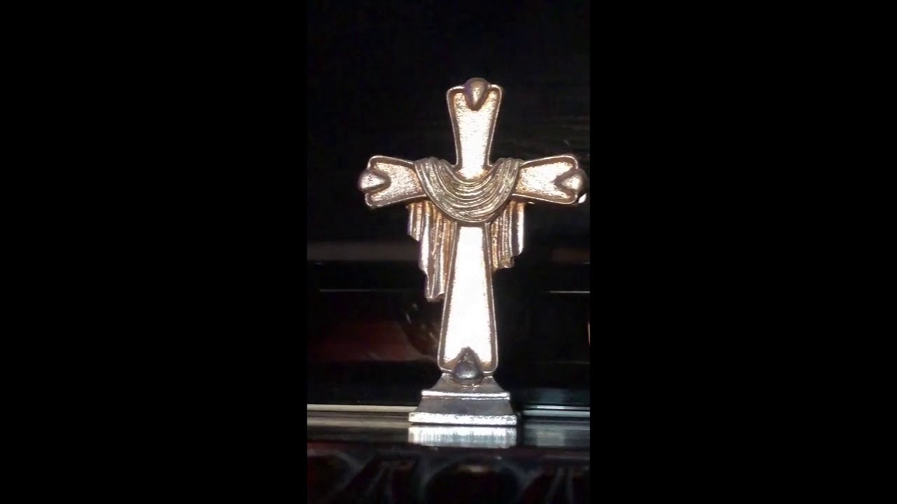 Beautiful silver cross shinning in the golden hour sun - YouTube