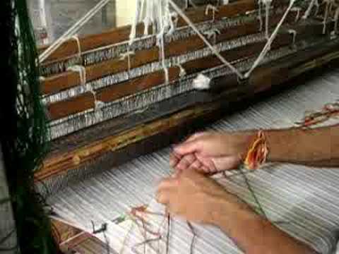 Man weaving cloth using weaving machine - YouTube