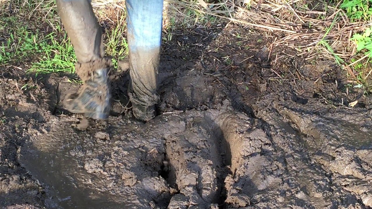 Black boots in deep mud - YouTube