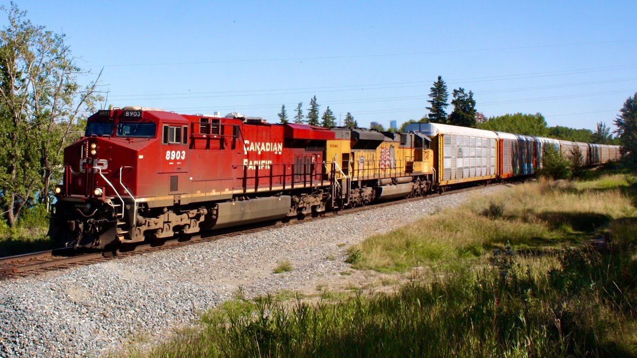 UP SD70ACe!!! CP 8903, UP 8348, and CP 8913 lead CP 199 west outta Calgary, Alberta - YouTube
