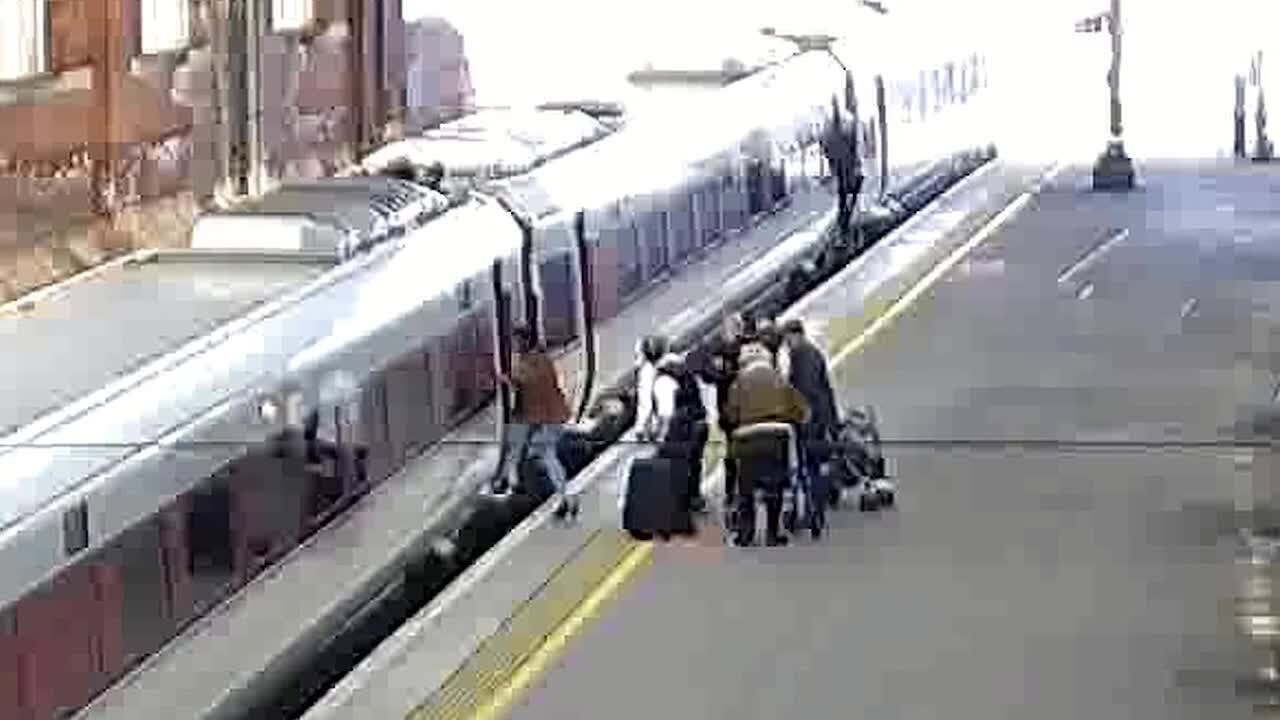 Children rescued after falling onto train tracks - YouTube