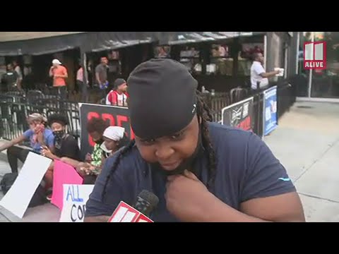 Atlanta protester gives brief rap on police brutality - YouTube