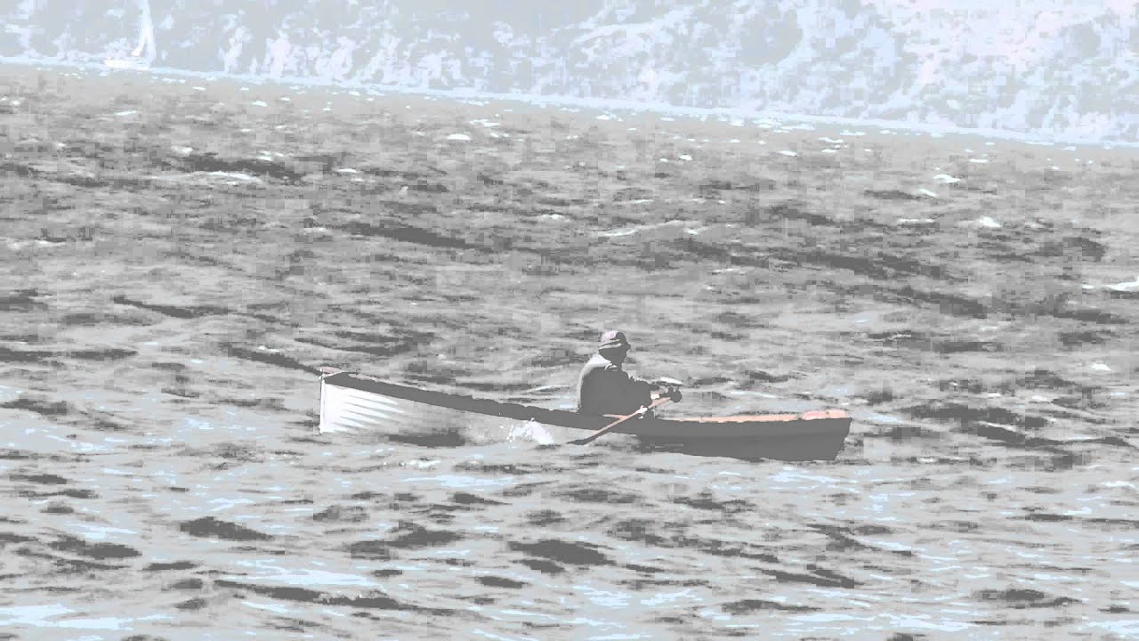 Man on a rowboat on a wave - YouTube