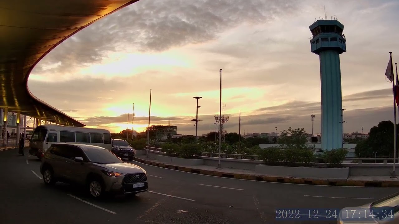 Facing the air traffic control tower of NAIA Terminal 2 before sunset ...