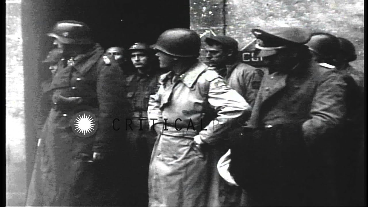 US General Joseph Lawton Collins confers with other officers in a ...