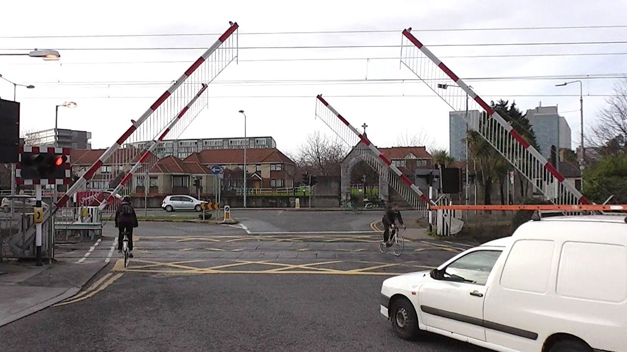 Merrion Gates Level Crossing - IE 8300 Class Dart Train - YouTube