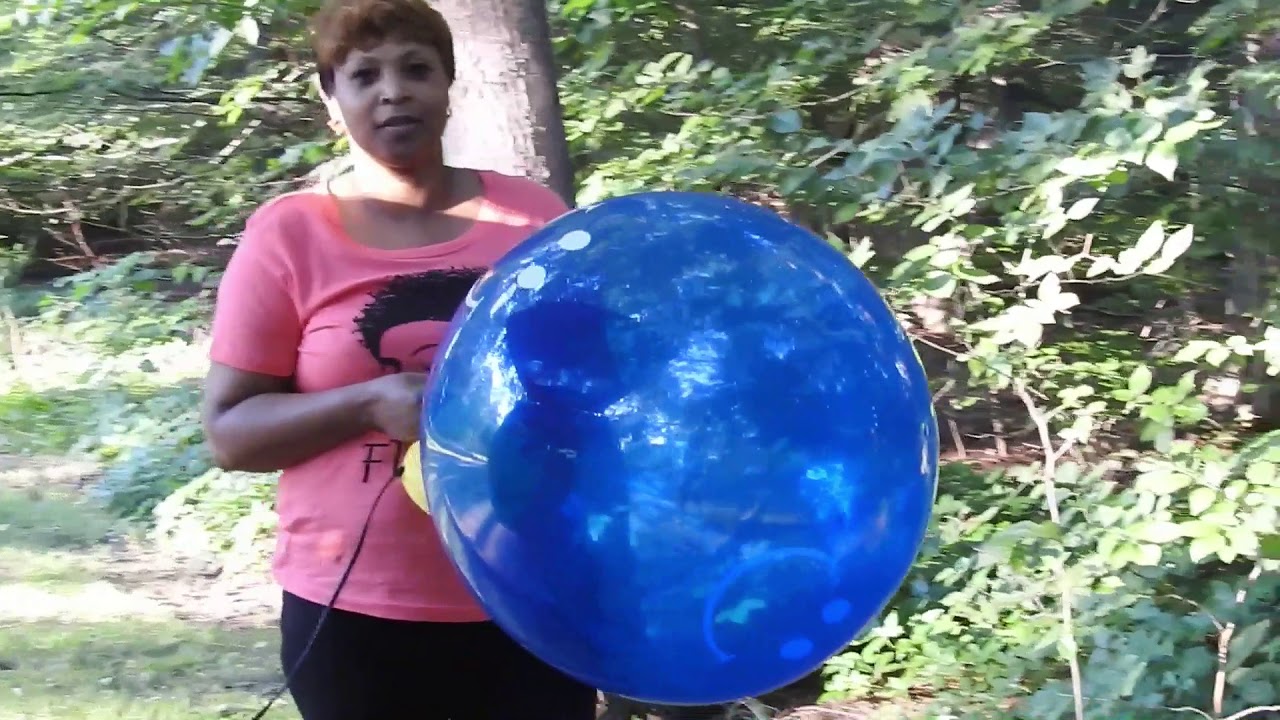 Carolyn's BIG blue balloon popping - YouTube