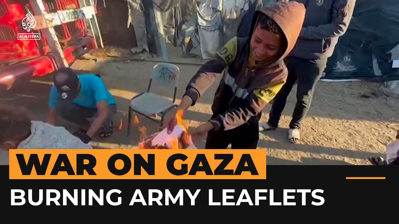 Displaced Palestinians burn Israeli army leaflets in Rafah | Al Jazeera ...