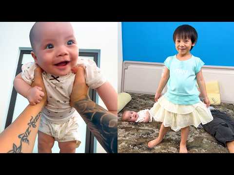 Baby Kim giggled with delight as dad lifted her high into the air