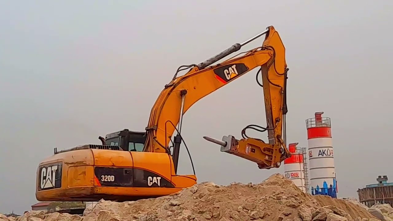 Excavator With Hydraulic Hammer Breaking Rock CAT 320D - Stone Breaking ...