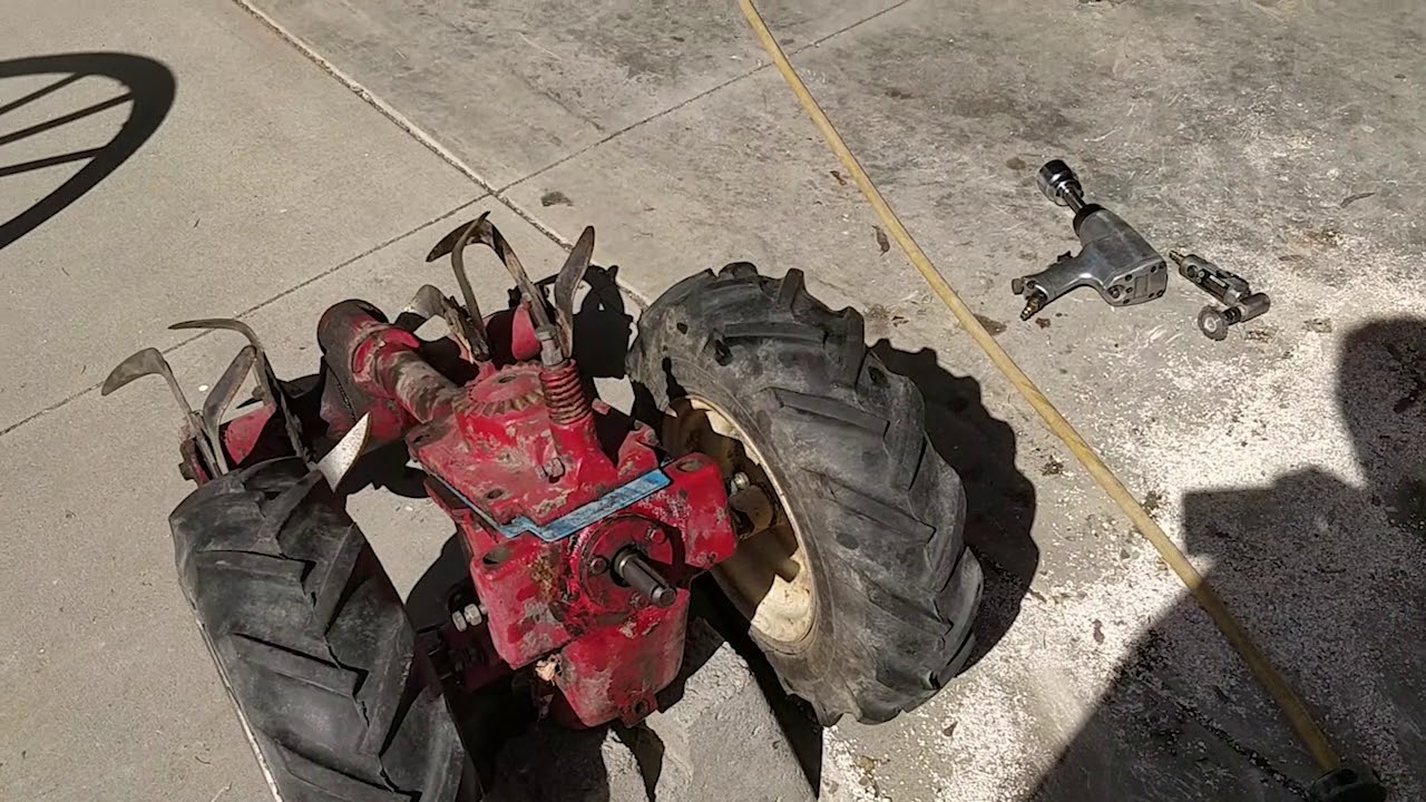 Free a stuck wheel on a troy bilt horse roto tiller - YouTube