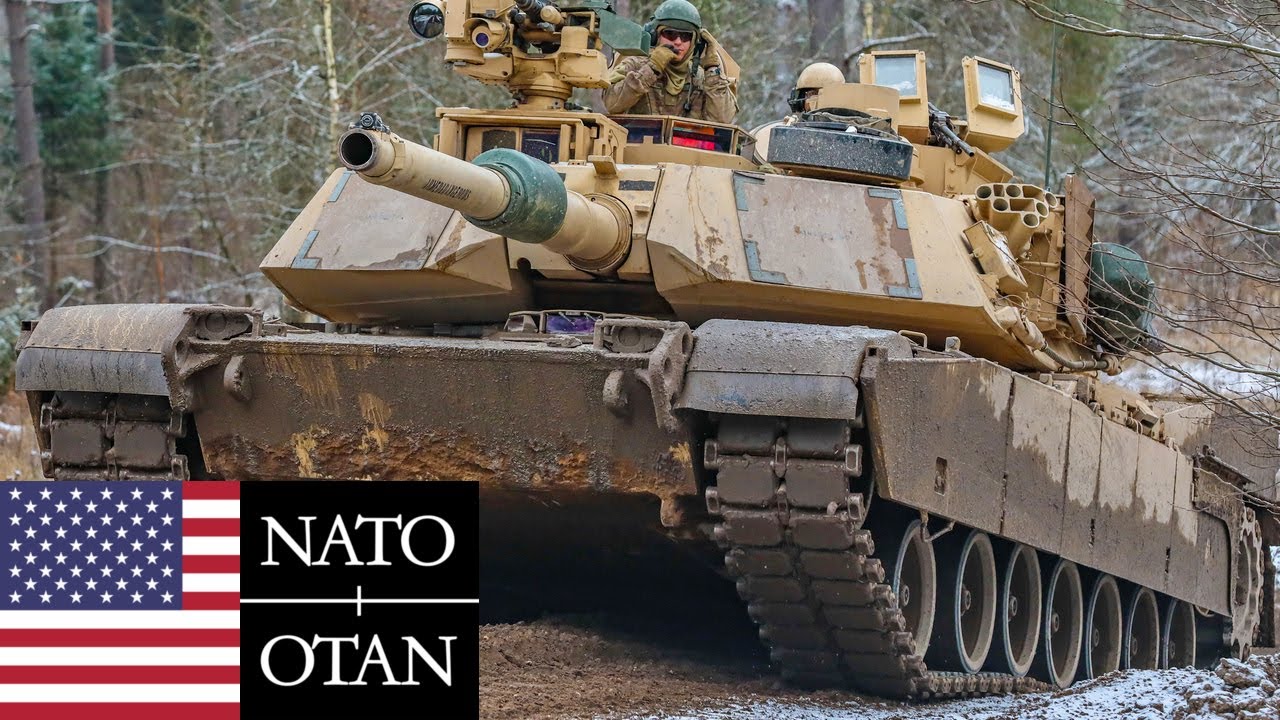 US Army, NATO. M1A2 Abrams tanks and Fighting Vehicles in a live fire ...