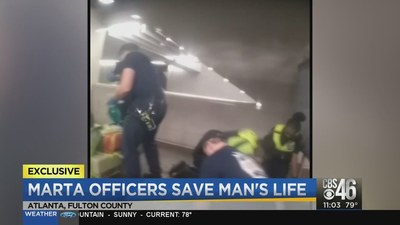 MARTA officers save unresponsive man's life - YouTube