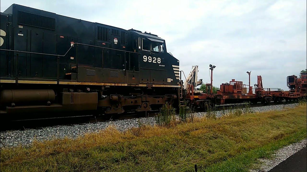 NS (Train symbol) 911 empty rail train With LHF NS 9928 RS5T Solo tied down in Alton Siding ...