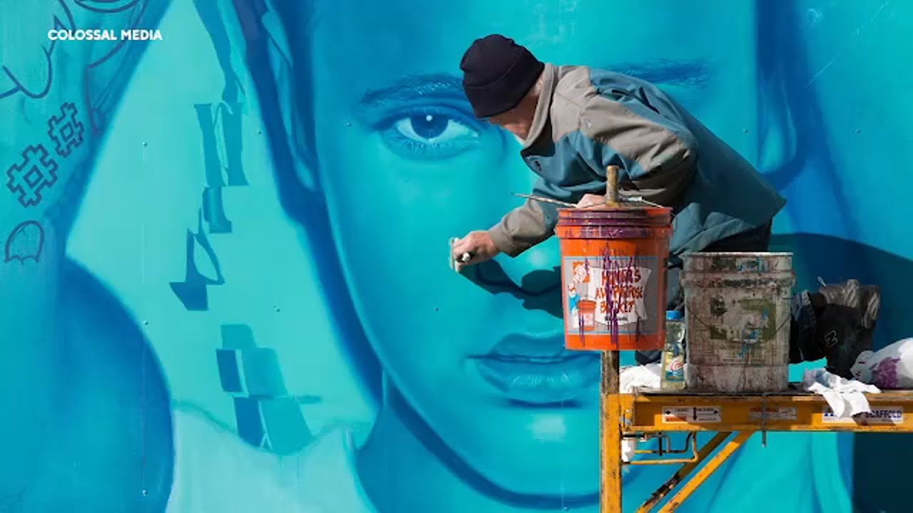 Artists dangle from buildings to hand paint massive billboards | In Our ...