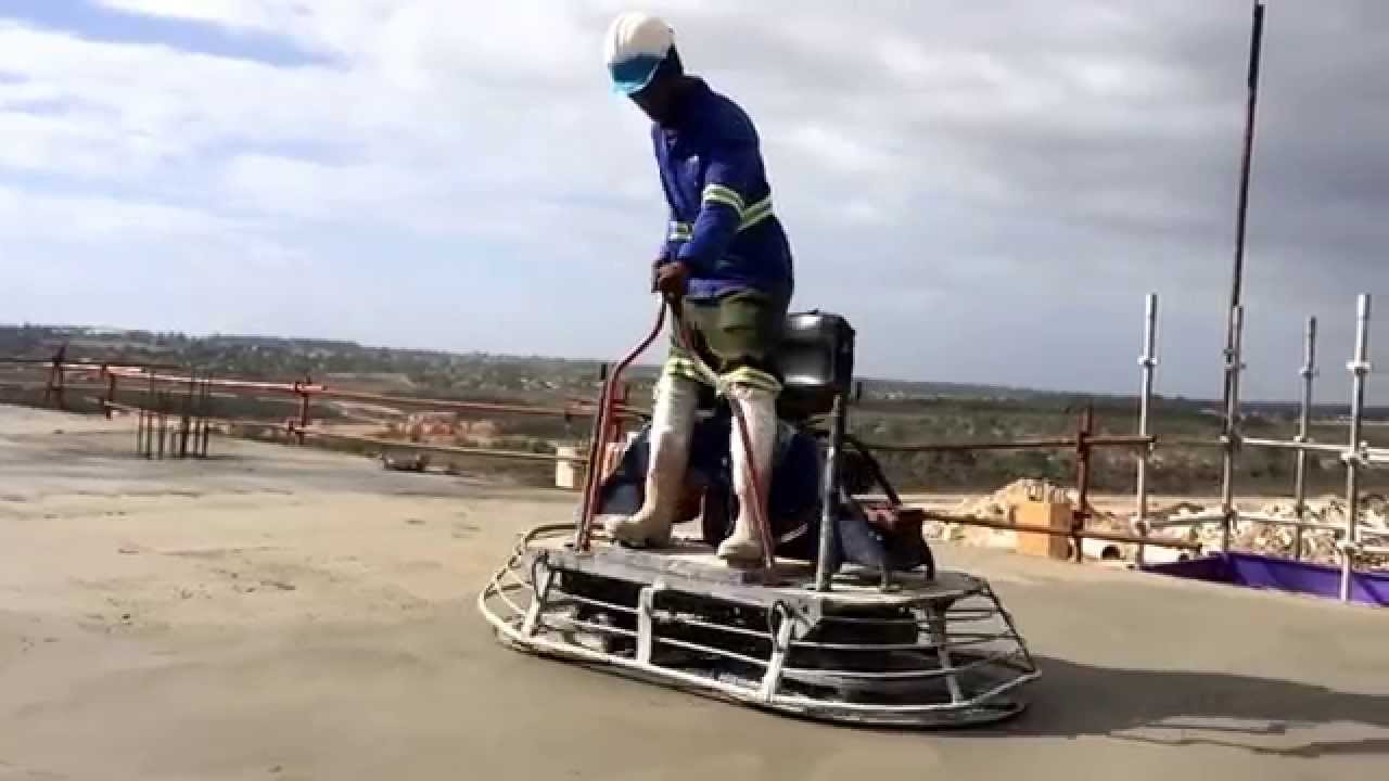 Finishing concrete on ride on machine. - YouTube