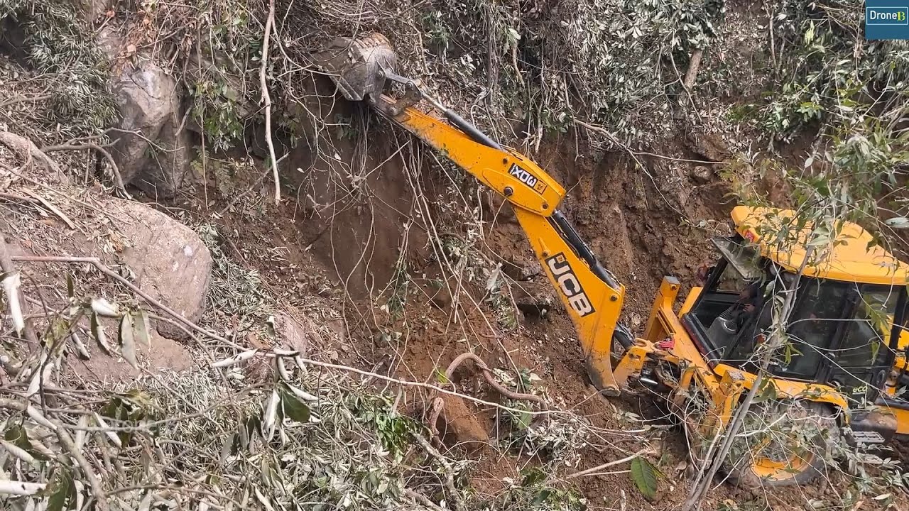 JCB Cutting Rocky Hillside for Logging Deck Road - YouTube