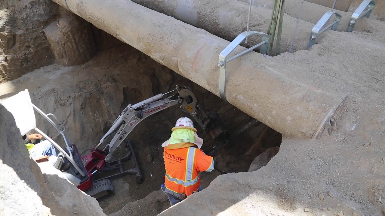 A Hybrid Mini Excavator at Work in a Trench - YouTube