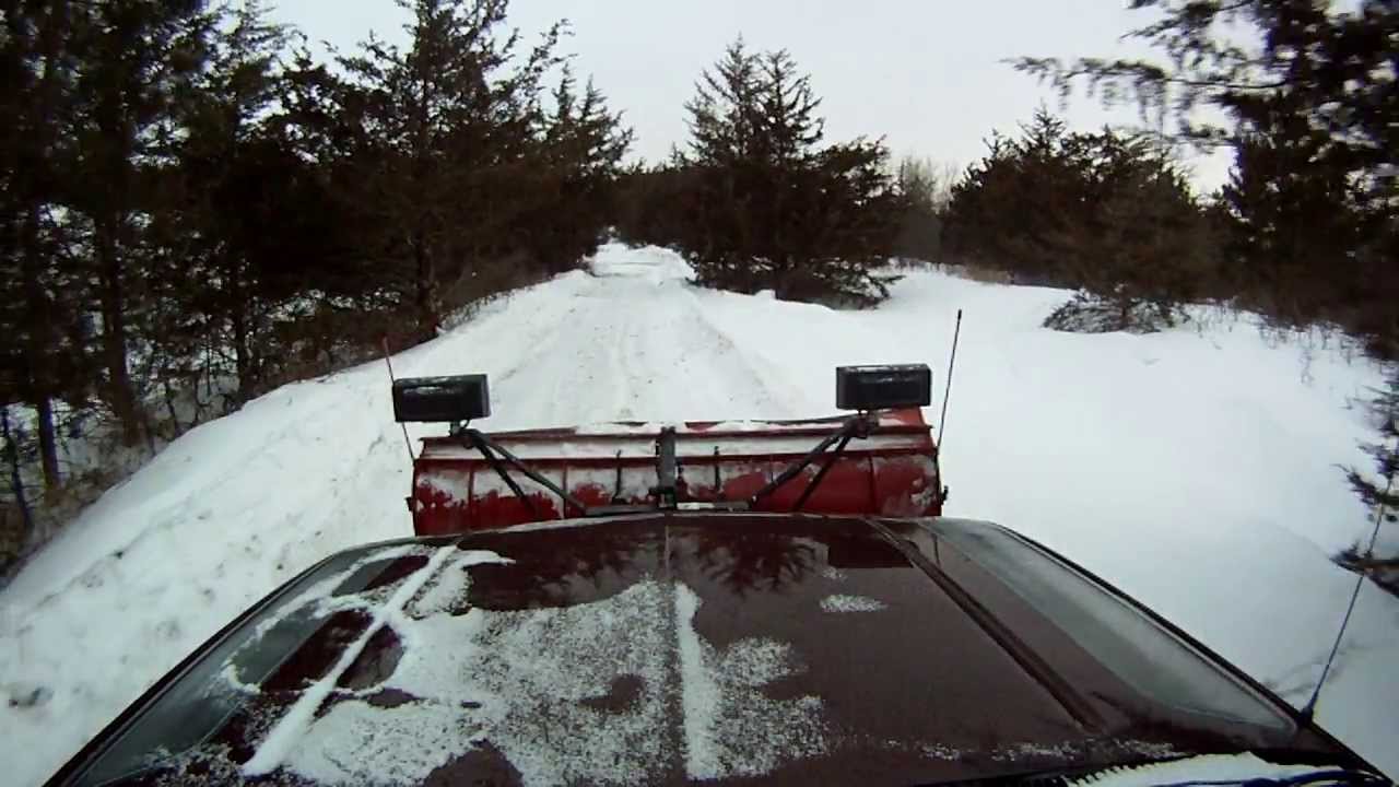 Plowing deep compacted snow (part 1) - YouTube