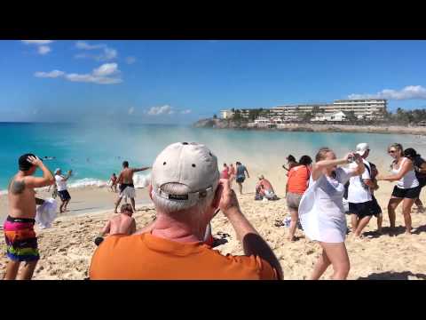 Jet blows people off beach