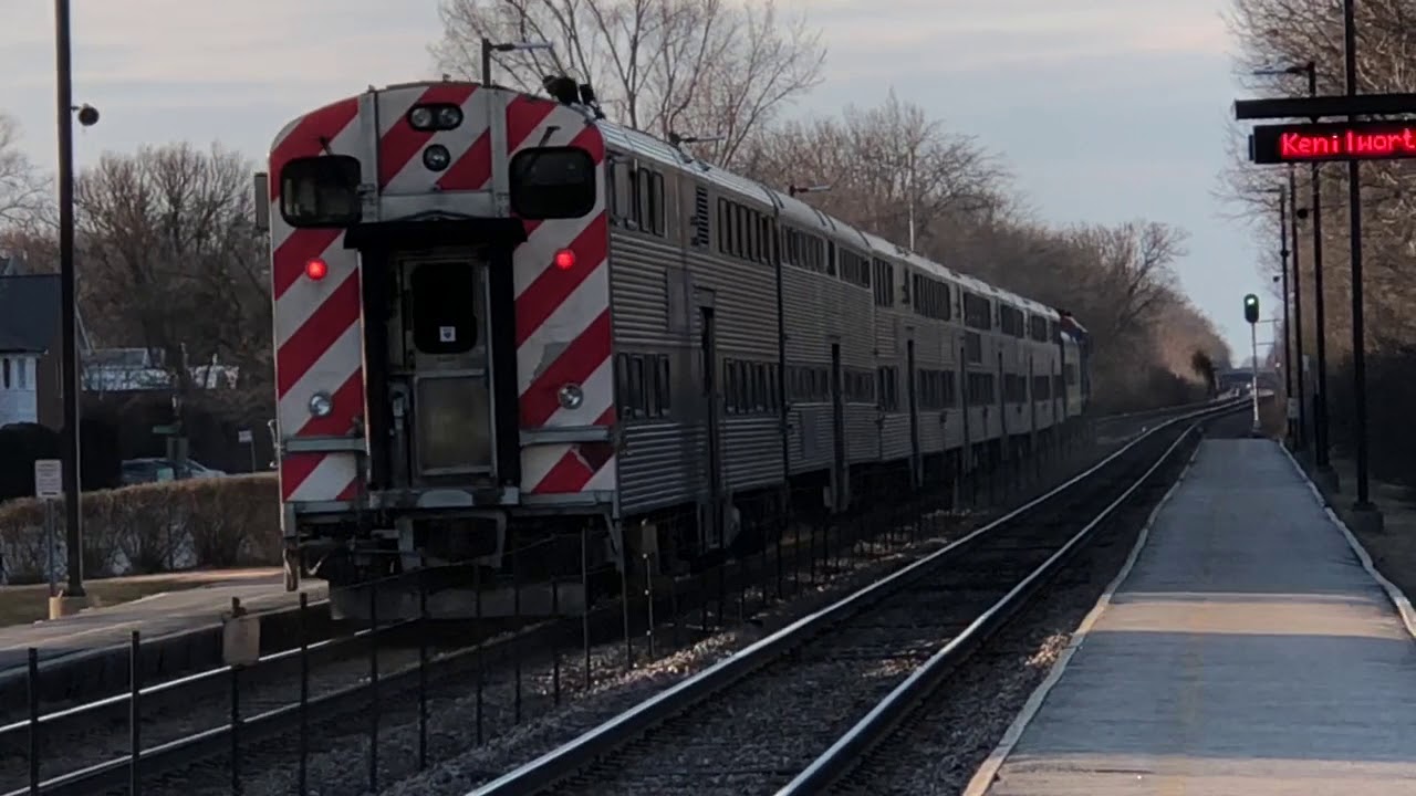 Metra 147 leading an outbound express though Kenilworth with CNW car ...
