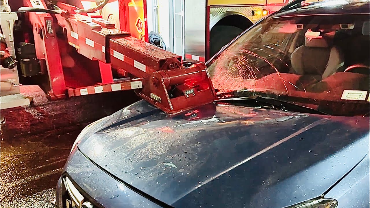 SHORT CLIP OF A TOWER LADDERS OUTRIGGERS vs CAR DURING A 5TH ALARM FIRE ...