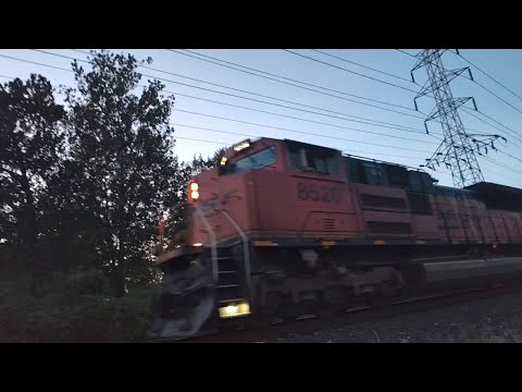 BNSF 8520 & 9290 pulling a hopper car train with 2 SD70ACE'S DUPs and of another train coming by ...