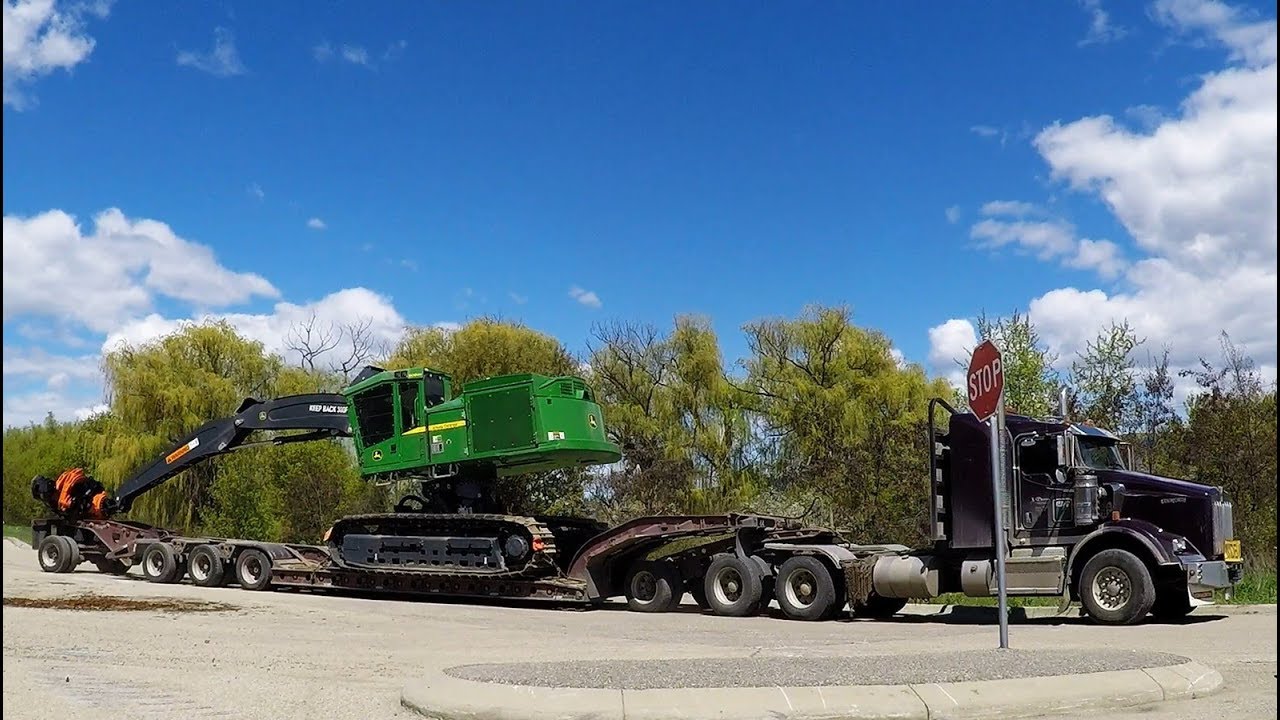 LOADED LOWBEDS TRANSPORT CAT 558 LL, JOHN DEERE 909 MH & HITACHI ZW150 ...