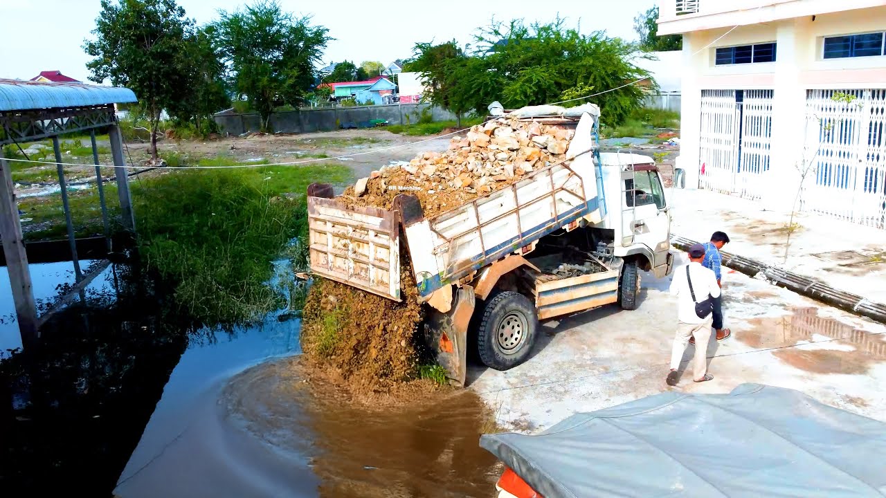 Filling big rock into the flood - YouTube