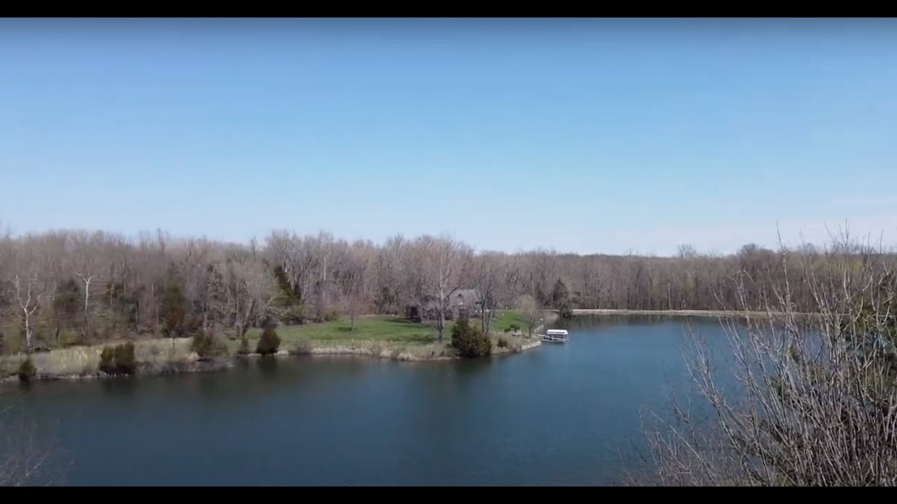Drone footage flying over lake near Center Point, Indiana - YouTube