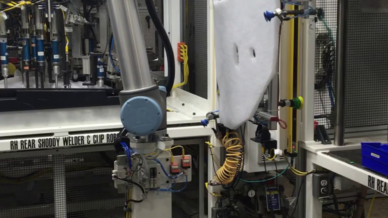 Universal Robot Collaborative Door Panel Assembly Cell - YouTube