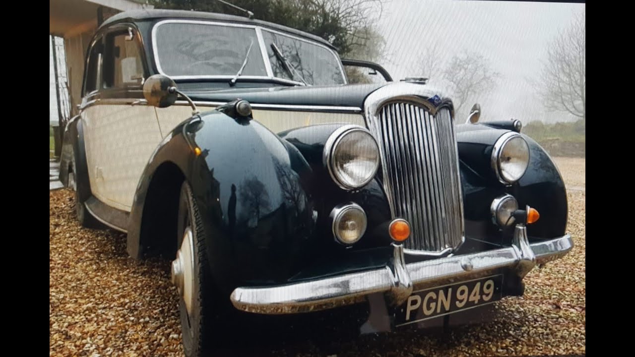 A 1954 Riley RME Saloon PGN 949 in a rural setting filmed fairly ...