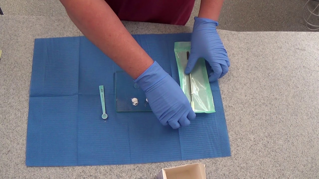 Dispensing and manipulating an intermediate restorative material - YouTube
