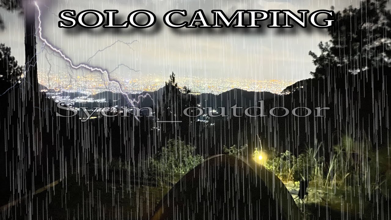 Solo camping on the mountain with a very beautiful city view ...