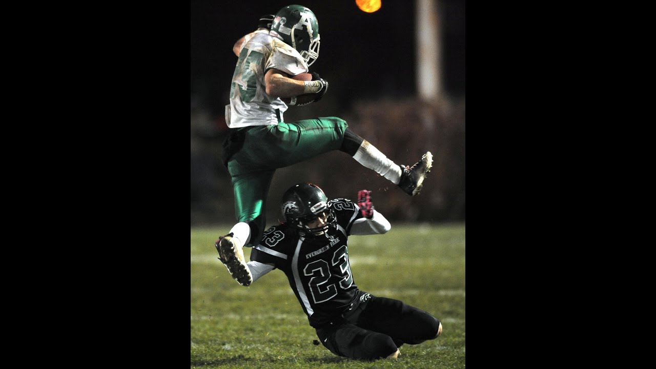Getting some air! Alleman's Adam Hoogerwerf hurdles a tackler for a ...